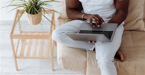 Man In White Crew Neck T Shirt And White Pants Sitting On White