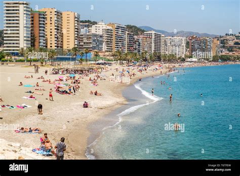Malaga Spain June Holidaymakers Sunbathing On Malagueta Beach Malaga Costa Del