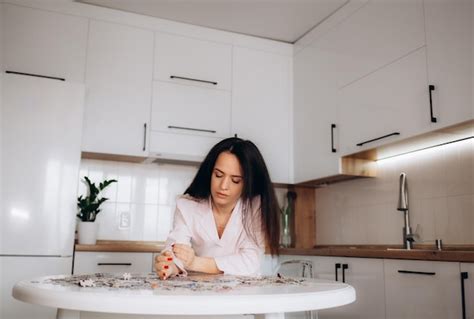Premium Photo Close Up Of Young Woman Doing Puzzle