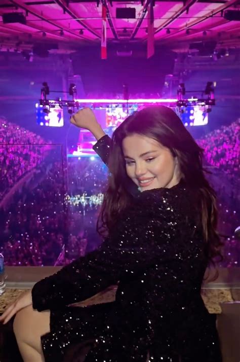 Selena Gomez dances in semi-sheer dress at Sabrina Carpenter concert with Benny Blanco