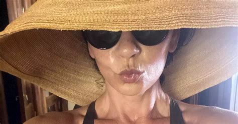 Catherine Zeta Jones Makes Summer Hotter In Plunging Swimsuit United