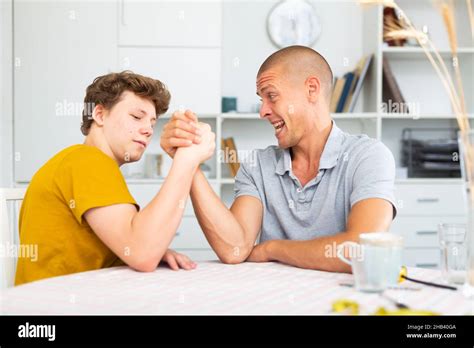 Father And His Son Doing Arm Wrestling Stock Photo Alamy