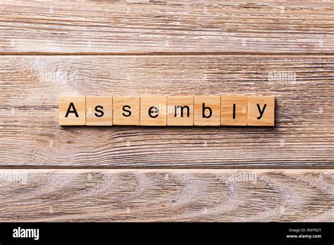 Assembly Word Written On Wood Block Assembly Text On Wooden Table For
