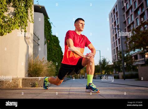 Warming Up Muscles Exercises Before Training Man In Sportswear