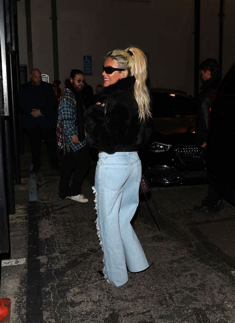 Karol G In A Corset Black Top Ripped Jeans And An Aviator Leather Jacket 01 11 2024 CelebMafia