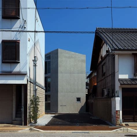 Timber Frame Projects Into Rooms And Stairwell Of Compact Kyoto Home
