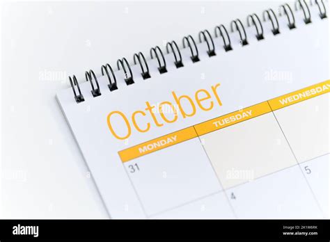 A Closeup Of A Calendar Opened On The October Month Page And Placed On