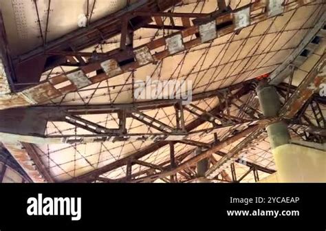 Rusted Framework Forms Intricate Grid Pattern In Abandoned Desert Structure Columns Hold Up