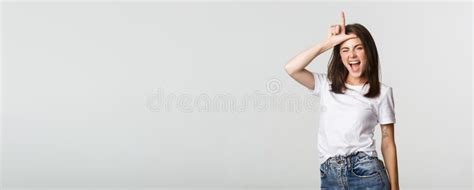 Sassy Good Looking Girl Smiling And Mocking Person Showing Loser