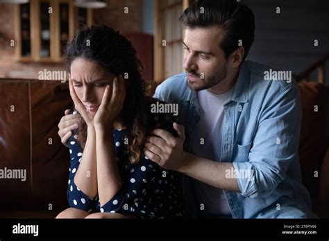 Close Up Caring Man Hugging Unhappy Woman Comforting Or Apologizing