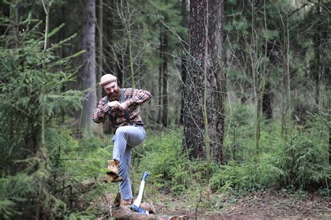 Premium Photo A Bearded Lumberjack With A Large Ax