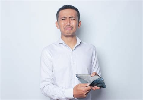 Premium Photo Adult Asian Man Showing His Empty Wallet With Expression
