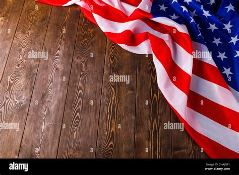 Crumpled Usa Flag On Flat Textured Wooden Surface Background Stock