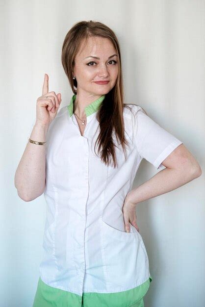 Premium Photo Professional Masseuse In Spa Uniform On White