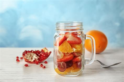 Premium Photo Delicious Fruit Salad In Mason Jar On Table