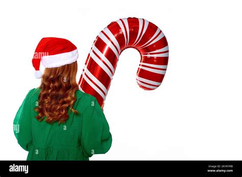 Christmas Girl Holding Huge Cane Balloon In Hands Wearing In Green