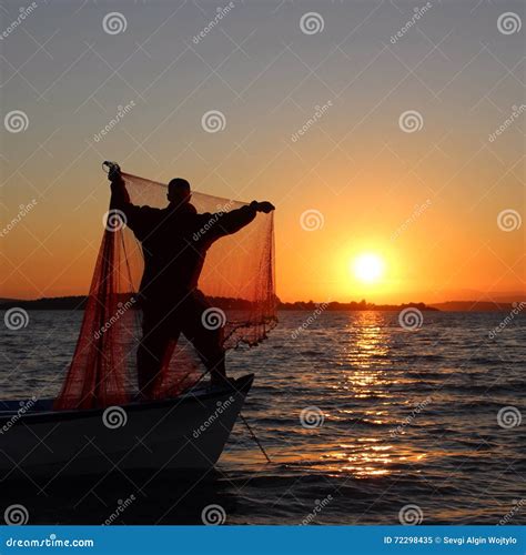Fisherman Holding The Fishing Net On The Boat And Sunset Stock Image Image Of Fish Village