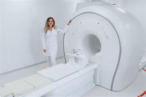 Premium Photo A Smiling Radiologist Stands In The Laboratory Next To
