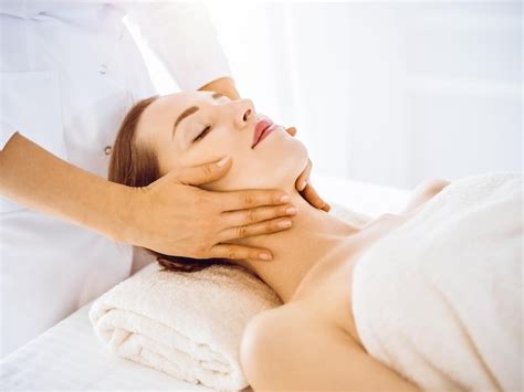 Premium Photo Beautiful Woman Enjoying Facial Massage With Closed
