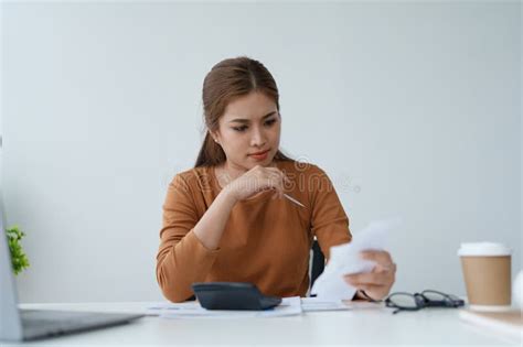 Smart Mortgage Planning Woman Using A Calculator To Make Calculations