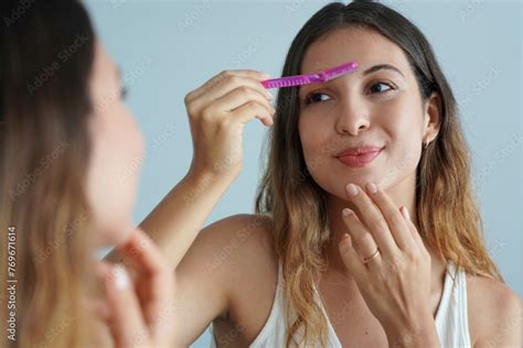Dermaplaning Beautiful Young Woman Shaving Her Eyebrows By Razor On