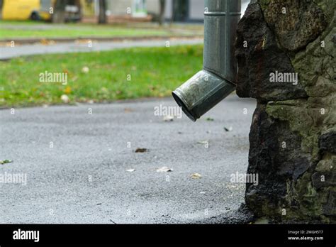 Downspout Of Rain Gutter Near The Side Of A House Side View Bottom Of