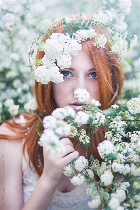 Young Beautiful Redhead Woman With Blue Eyes And Freckles In White