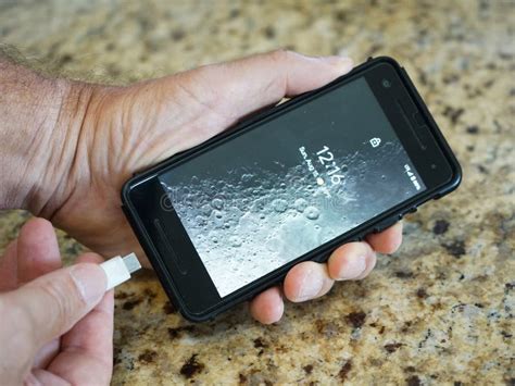 Man X S Hands Plugging Cell Phone Into Charger Stock Photo Image Of Charge Empty