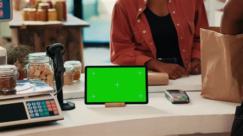Tablet Running Display With Blank Greenscreen At Checkout Showing