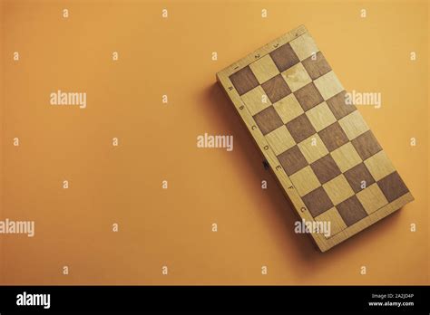 Beautiful Old Chess Board On A Orange Background Stock Photo Alamy