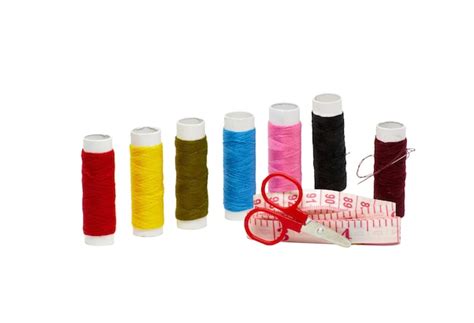 Premium Photo Seven Spools Of Colored Thread Small Scissors And