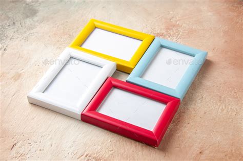 Side View Of Colorful Picture Frames Hanging On Nude Color Wall With Free Space Stock Photo By
