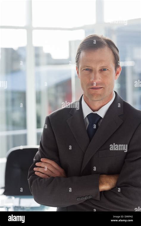 Confident Businessman With Arms Folded Stock Photo Alamy