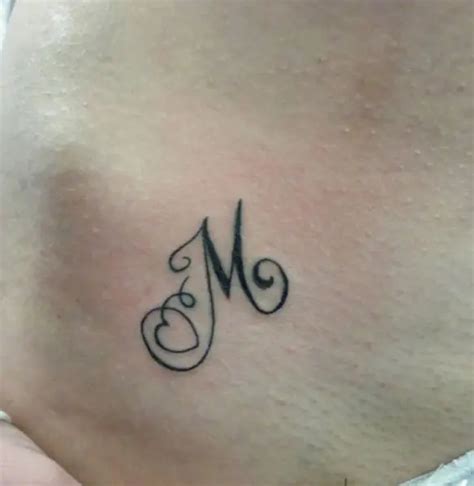 Tattoo Letter M On Neck