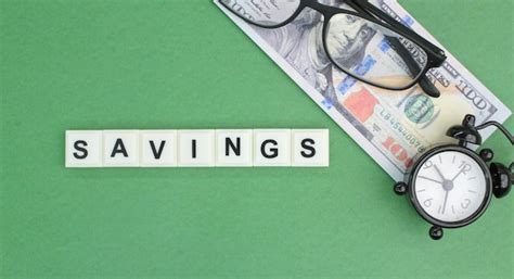 Premium Photo Paper Money Glasses And An Alarm Clock With The Word