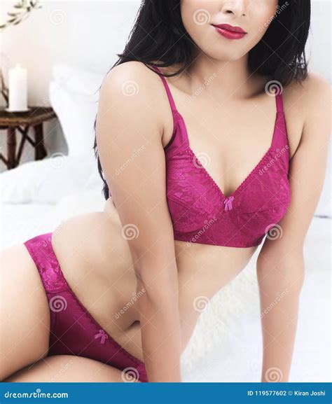 Figure Of Young Lady In Reclined Position Wearing Red Wine Color