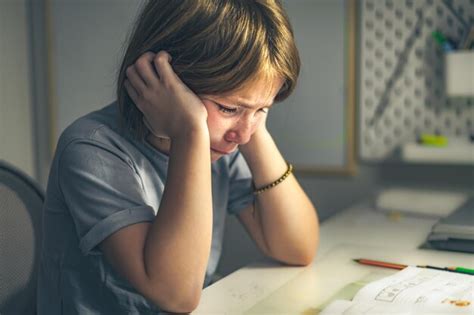 Premium Photo Upset Schoolgirl Doing Lessons Her Homework Learning