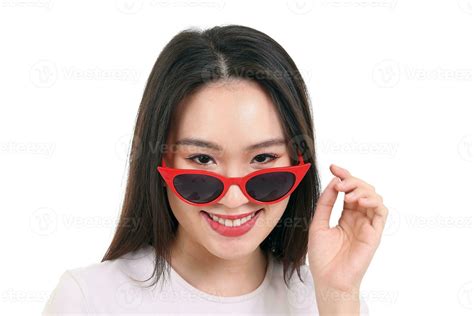 Beautiful Young South East Asian Woman Peaking Over Wearing Red Frame