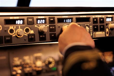 Free Photo Captain Pushing Buttons To Fix Altitude Level On Control Panel Command Using