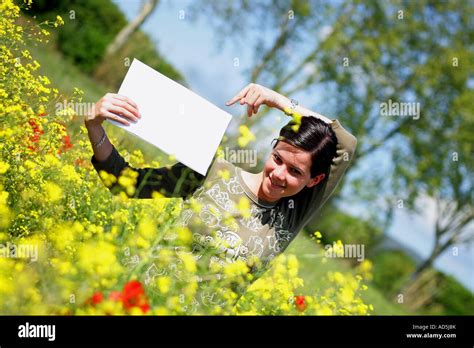 Girl Showing A White Display Board Stock Photo Alamy
