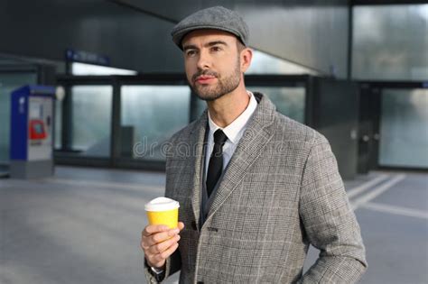 Classic Looking Businessman With Winter Clothing Walking With Coffee