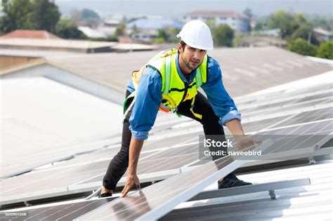 Electrical Engineering Man Installing Solar Cell Panels On Roof Solar