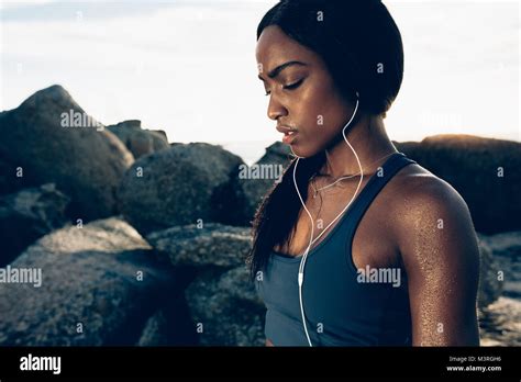 Healthy Young Woman With Sweat Standing Outdoors After Her Workout
