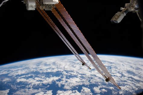 Iss Cubesat Deployment Over Earth With Solar Arrays From Pikwizard