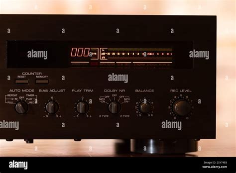 Close Up Of A Retro Audio Tape Deck With Backlit Panel Analog Controls And Dials Displaying A