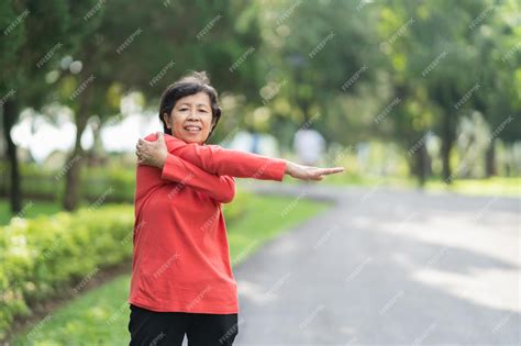 Premium Photo Senior Asian Woman Body Warming Before Exercising Old