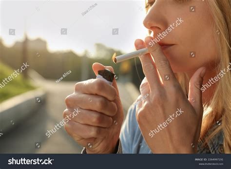 Girl Lighting Cigarette