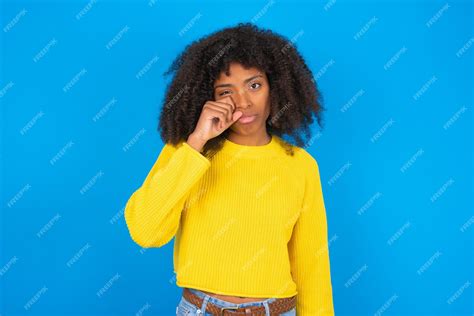 Premium Photo Disappointed Dejected Woman Wipes Tears Stands Stressed