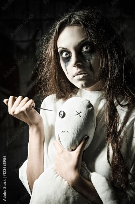 Horror Style Shot Scary Monster Girl With Moppet Doll And Needle In