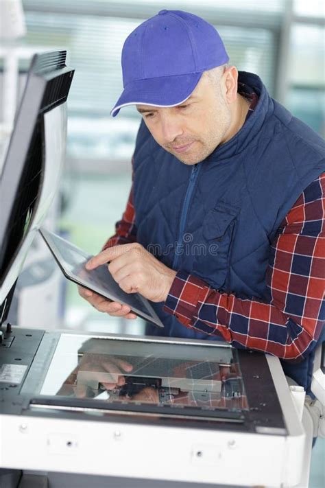 Man Using Tablet For Fixing Printer Stock Image Image Of Production
